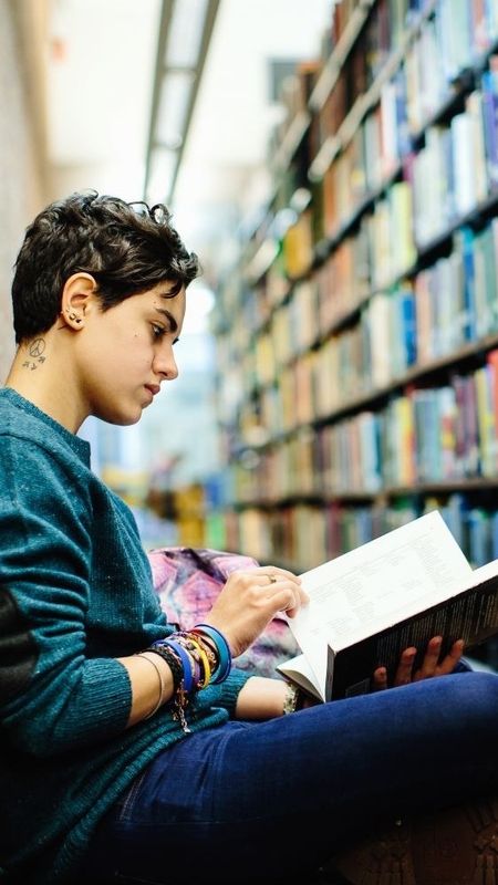 Boy Reading Books Wallpaper